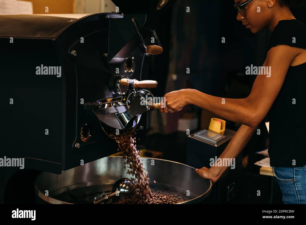 Side View Of Young Barista Working In Cafe Stock Photo - Alamy