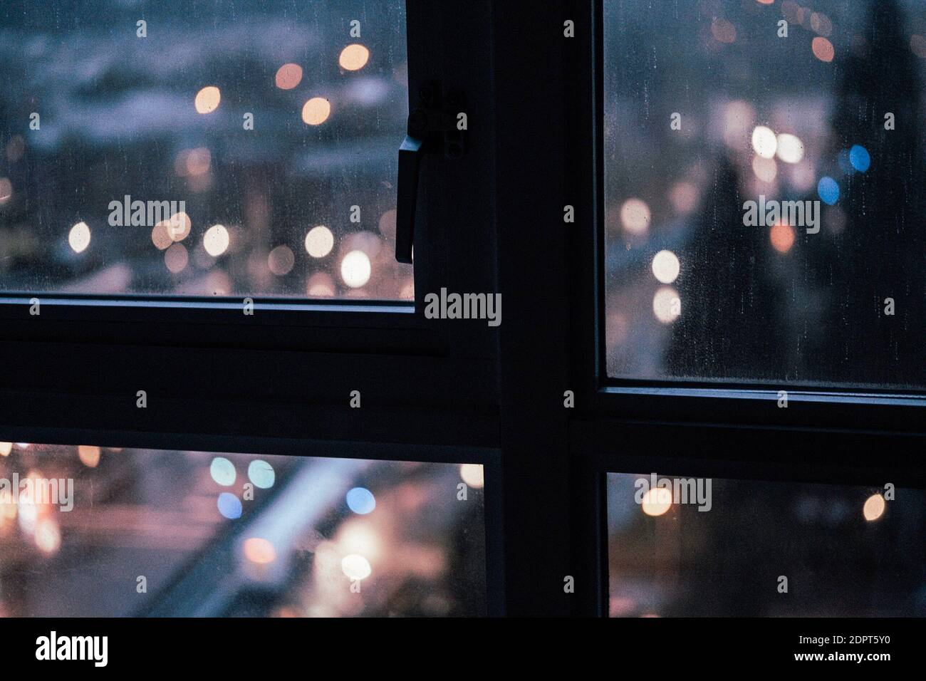 City through rainy window at night hi-res stock photography and images ...