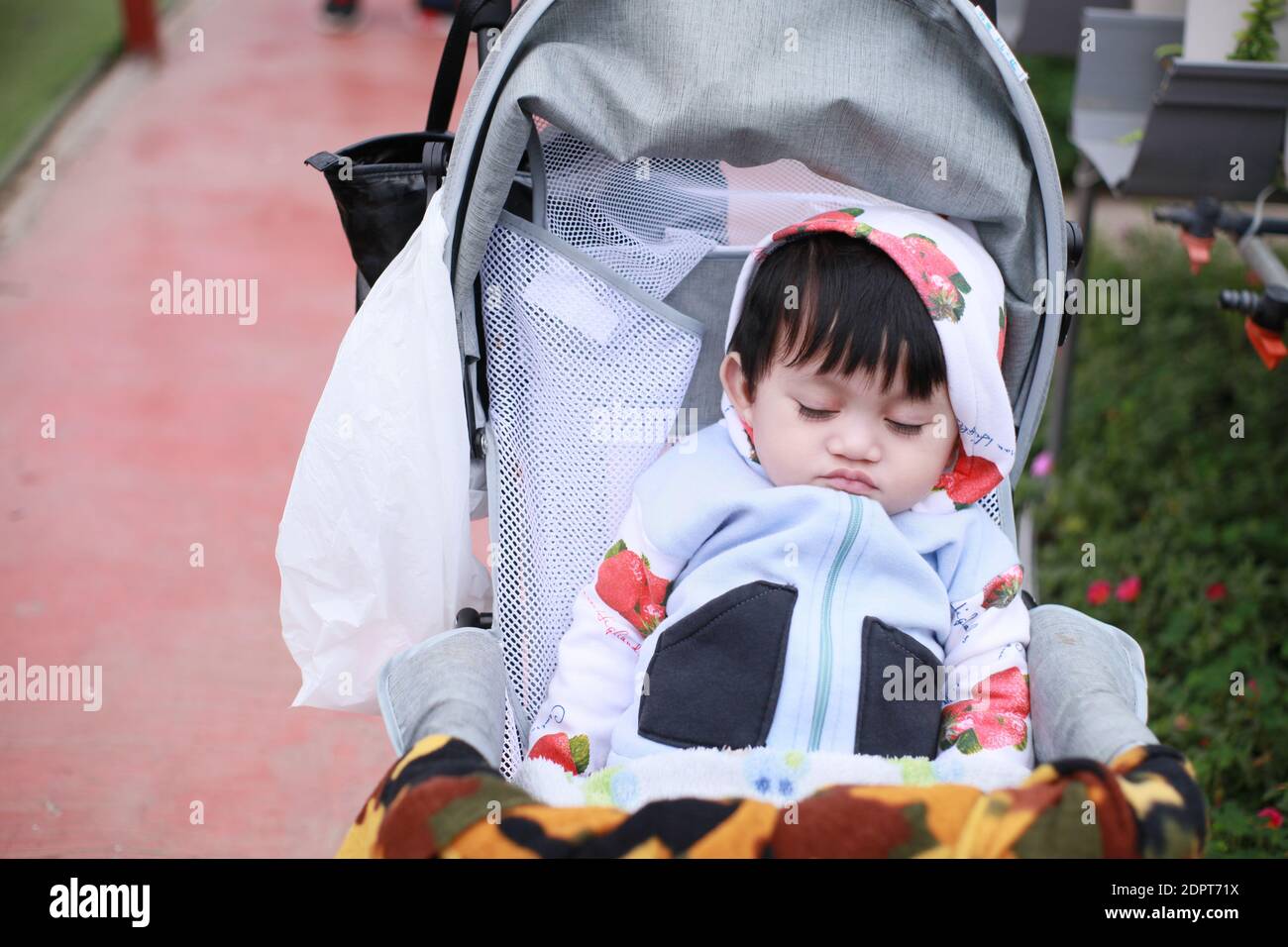Sleeping In Stroller High Resolution Stock Photography and Images - Alamy