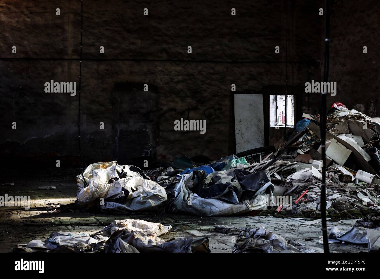 Abandoned Garbage By Building Stock Photo - Alamy