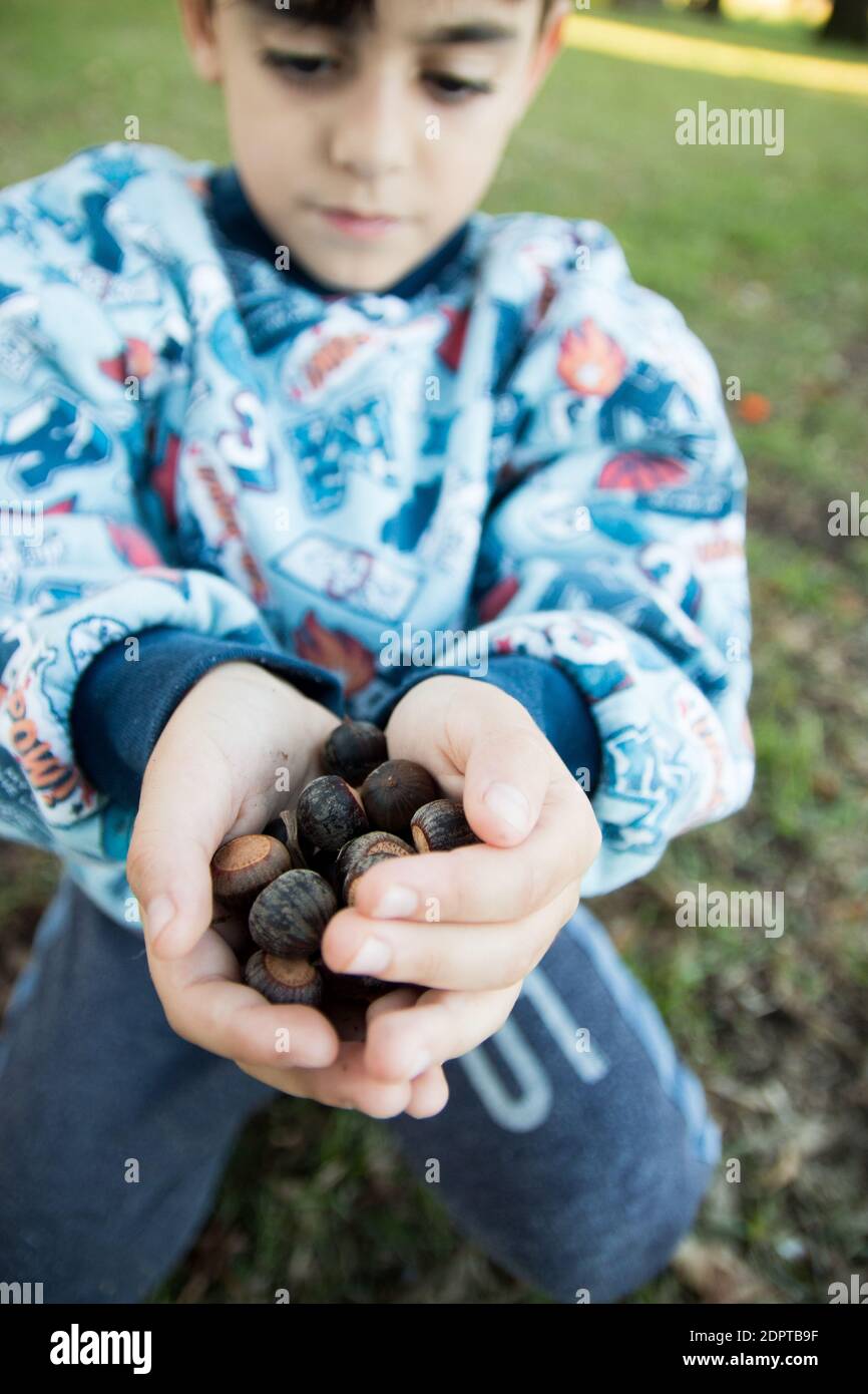 Crouching holding food and drink childhood hi-res stock photography and ...