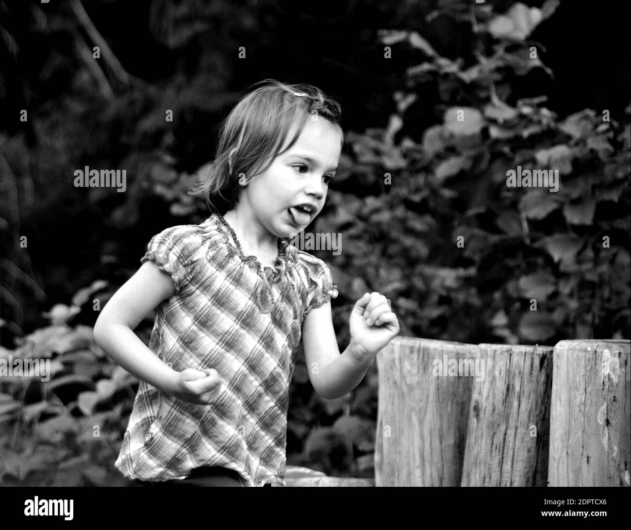 Little girl playing running on Black and White Stock Photos & Images ...