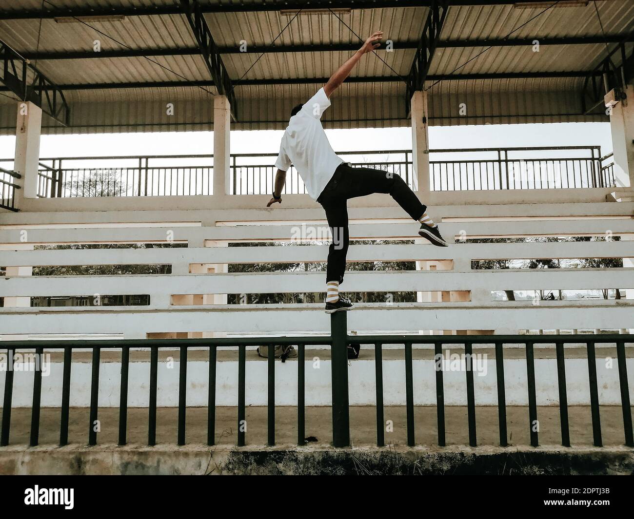 Men jumping fence hi-res stock photography and images - Alamy