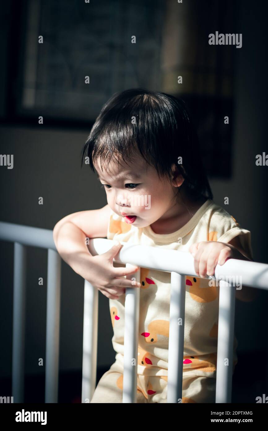 Three Baby Girls In Crib High Resolution Stock Photography and Images ...