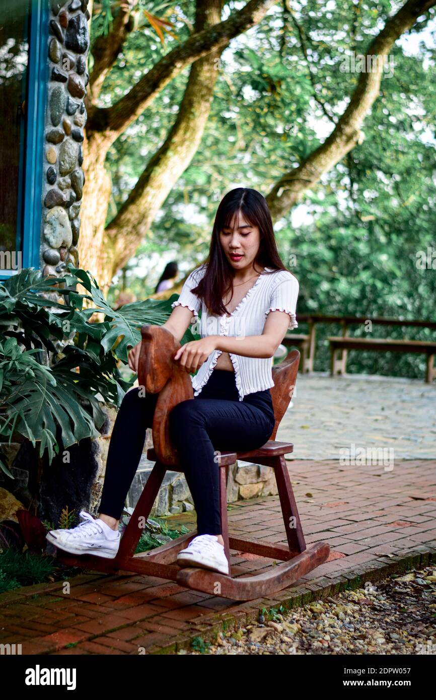 Asian woman rocking chair hi-res stock photography and images - Alamy