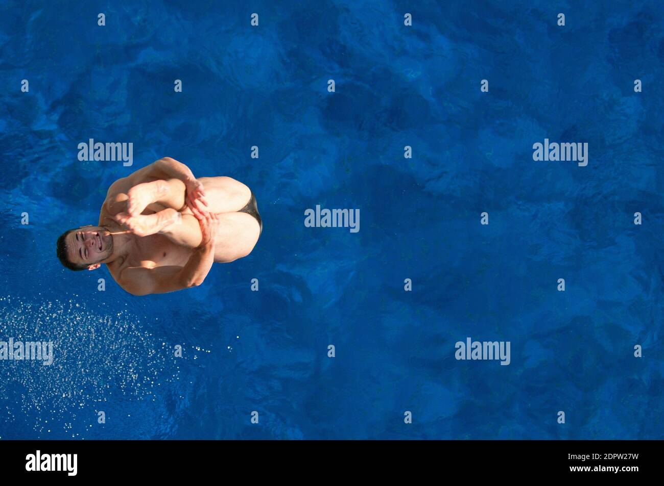 Man jumping in swimming pool day hi-res stock photography and images ...