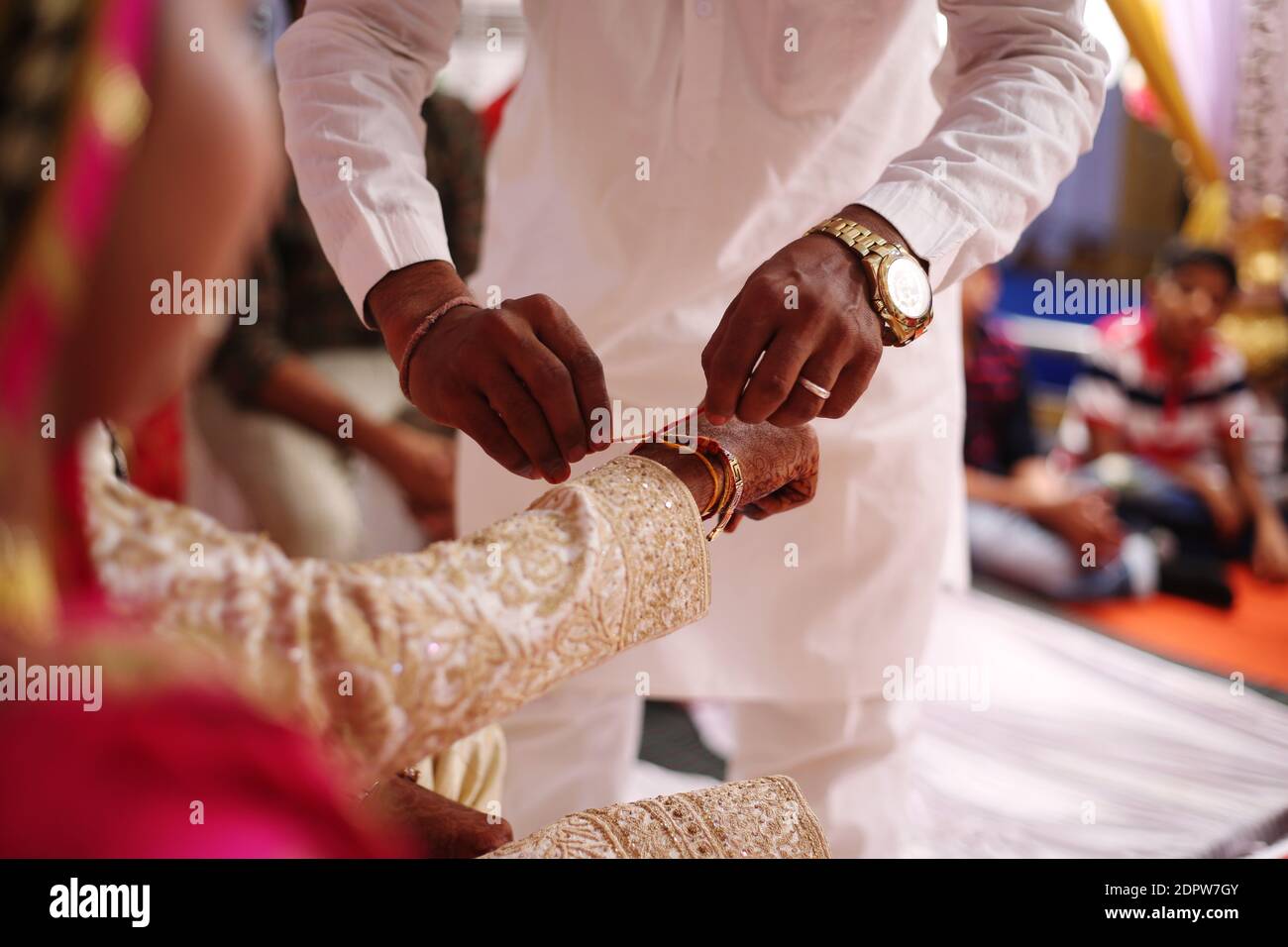 Women tying thread hi-res stock photography and images - Alamy