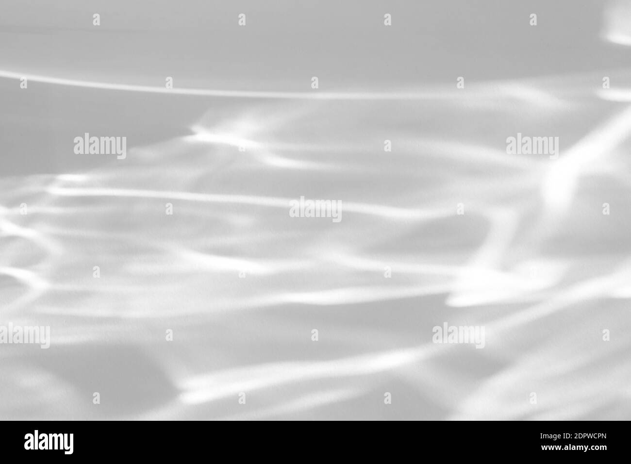 shadow and light caustic effect on a white wall Stock Photo - Alamy