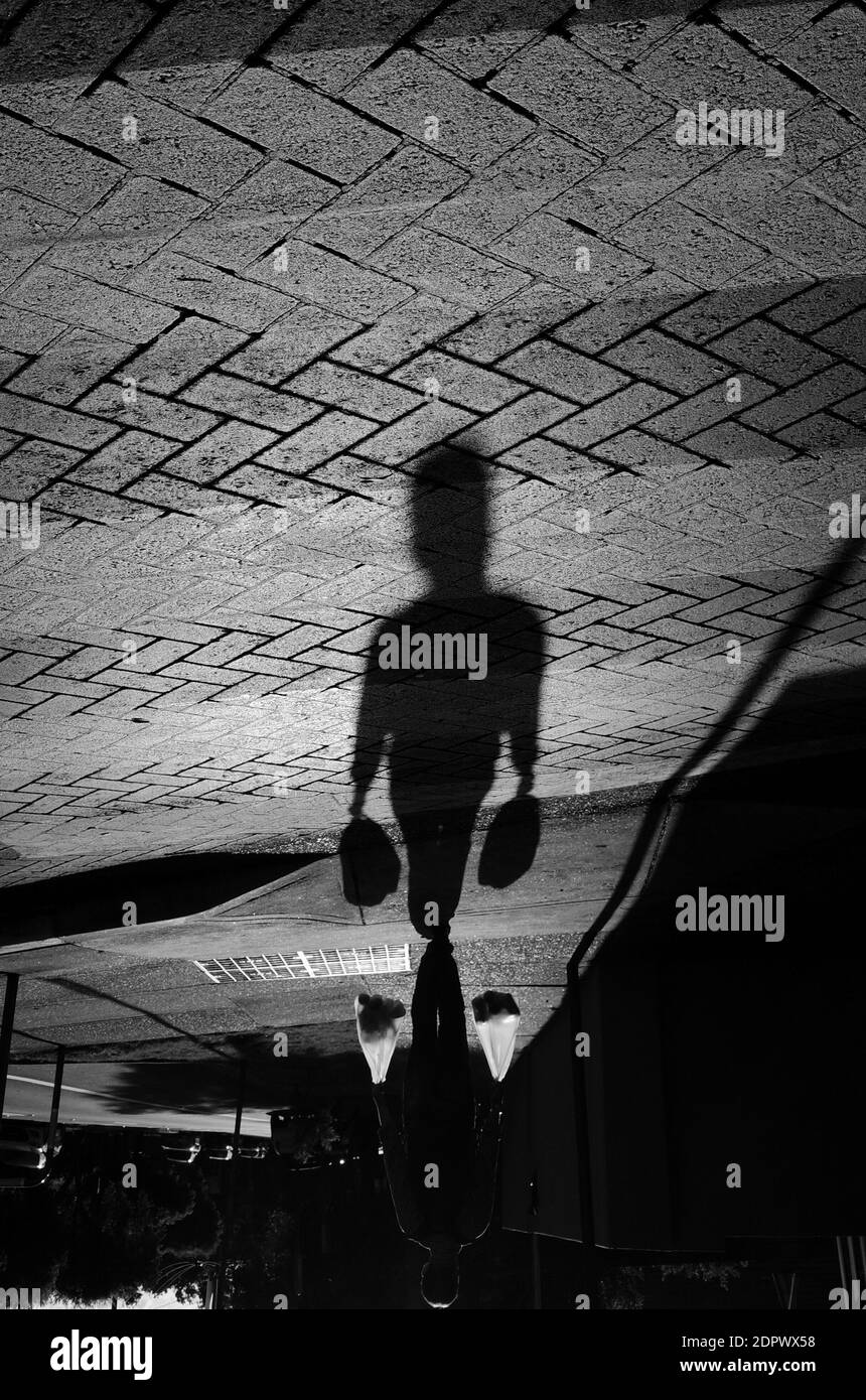 Silhouette men standing on street Black and White Stock Photos & Images ...