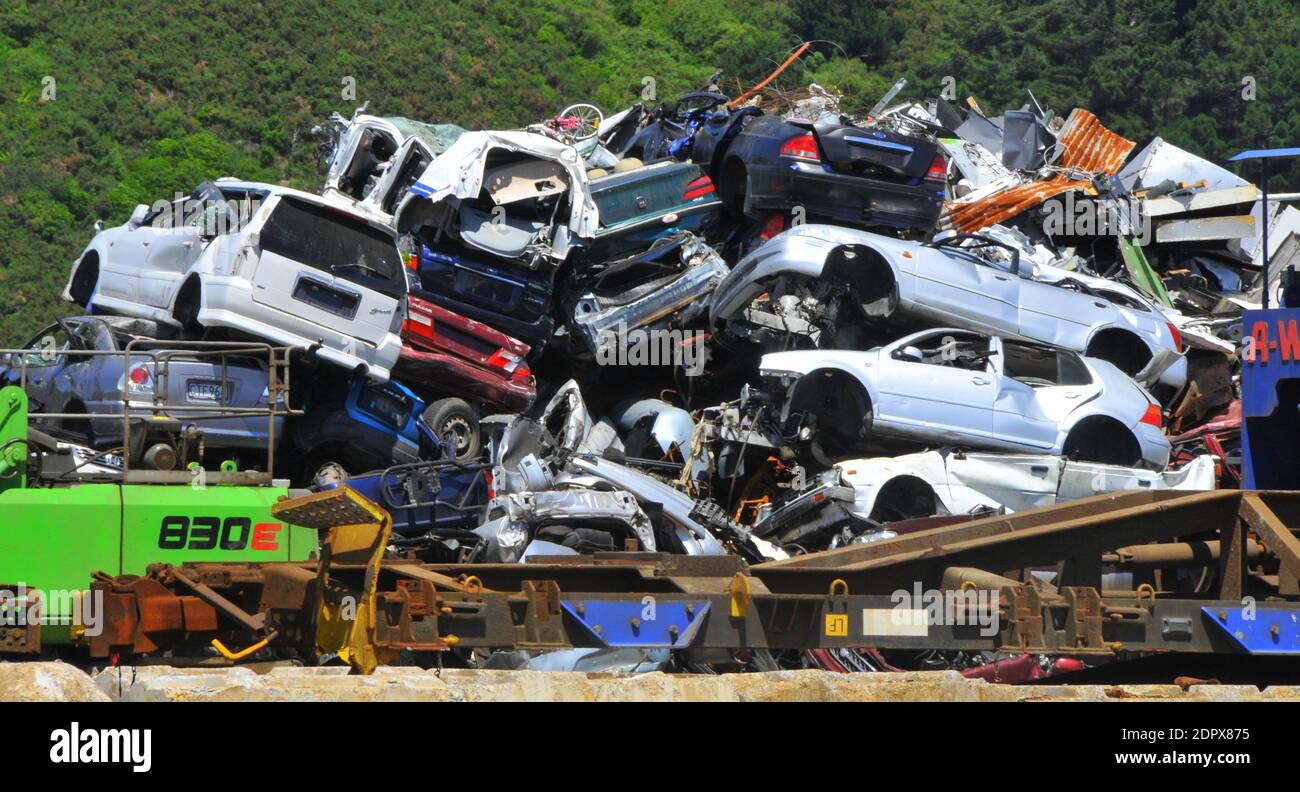Wrecked cars stacked at metal recycling yard Stock Photo - Alamy