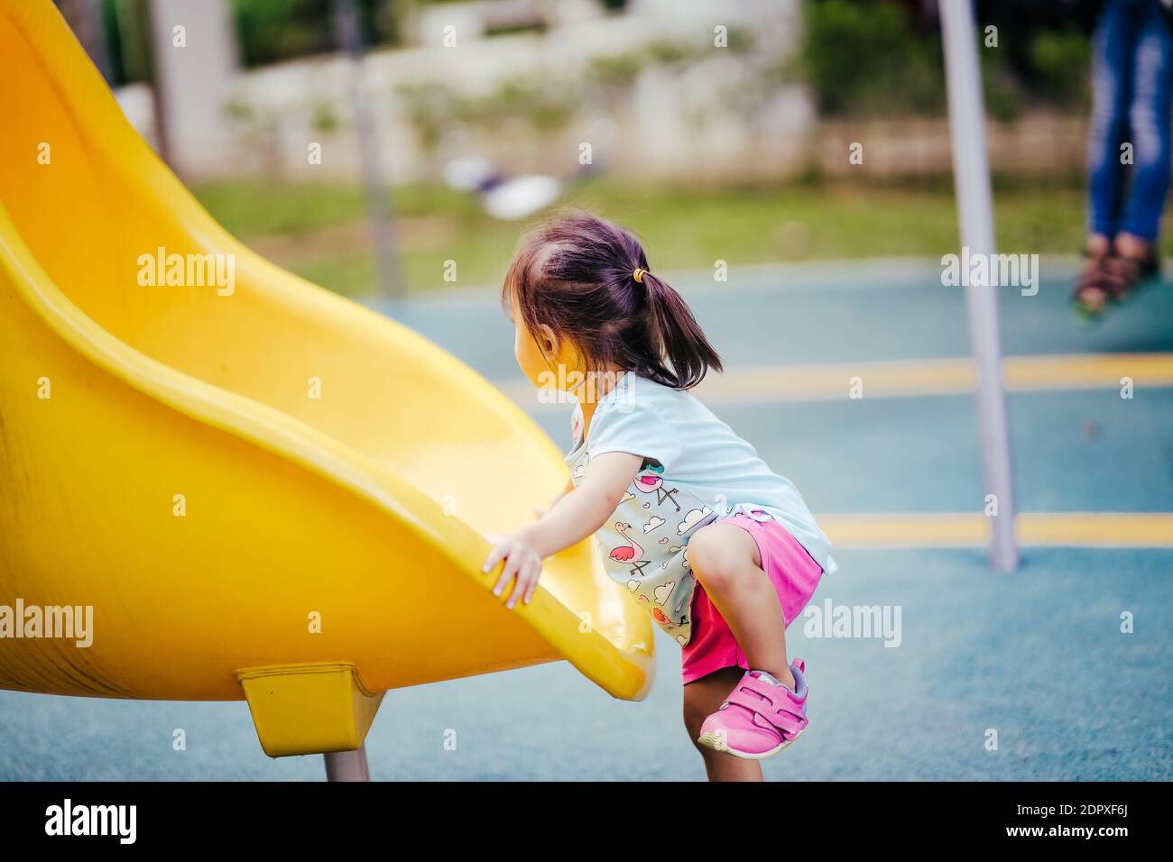 Girl On Slide Side View High Resolution Stock Photography and Images ...