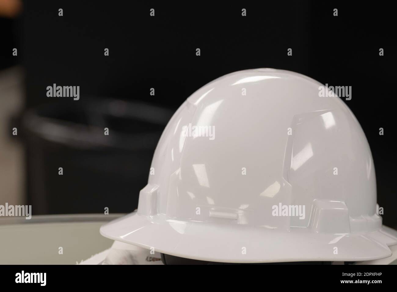 white safety hardhat safety helmet in factory Stock Photo - Alamy