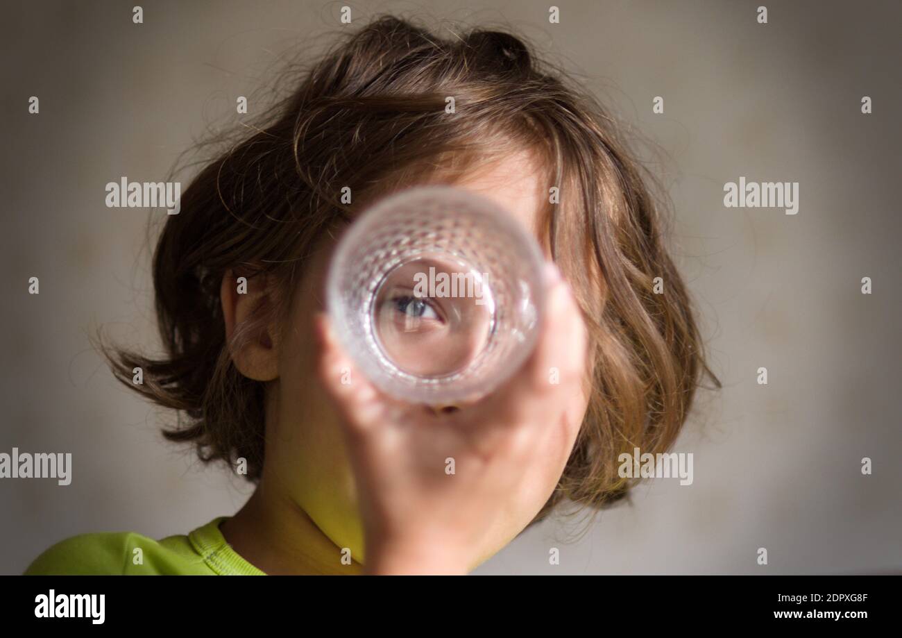 Boys face through glass hi-res stock photography and images - Alamy