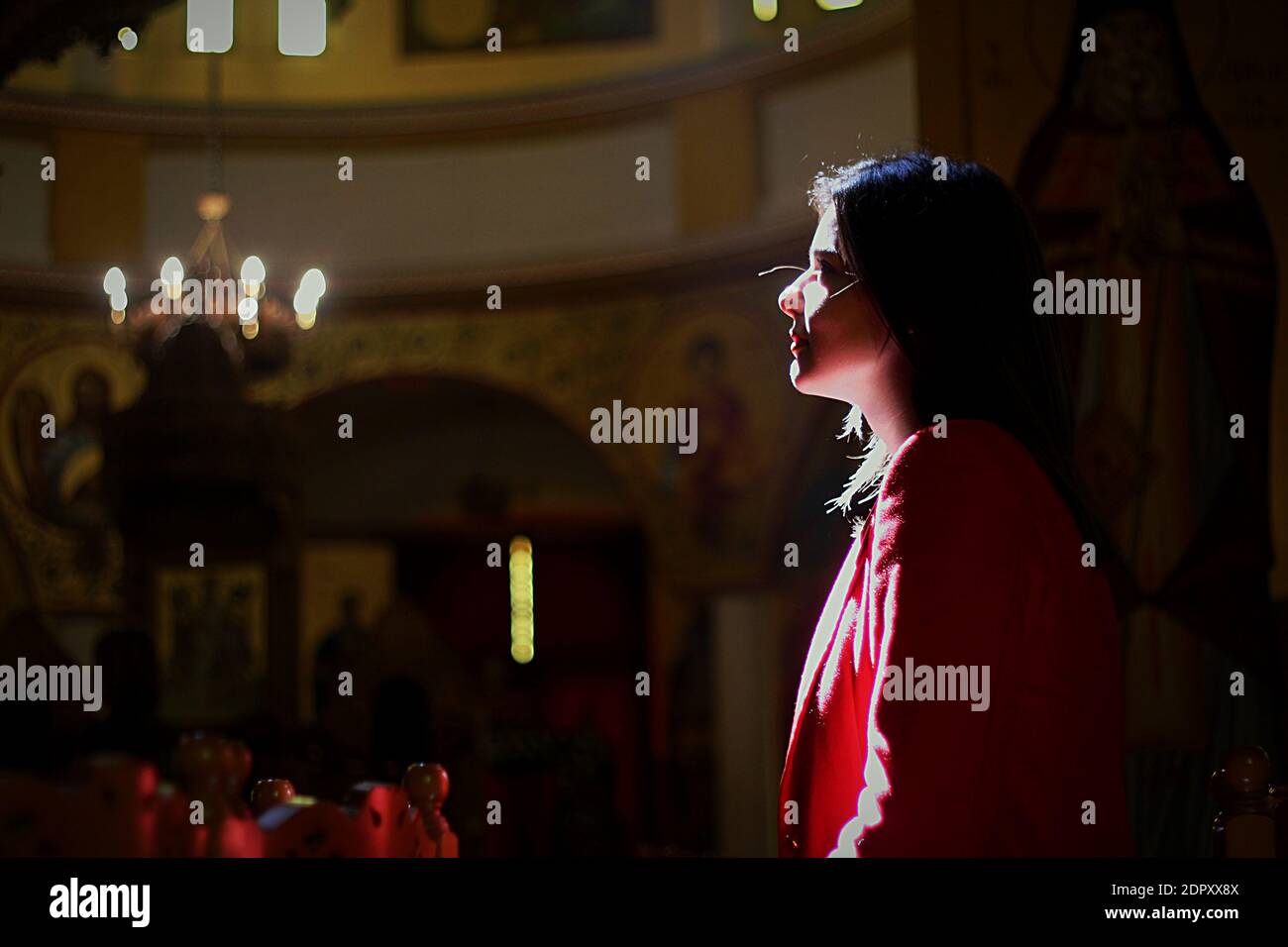 Caucasian woman praying in church hi-res stock photography and images ...
