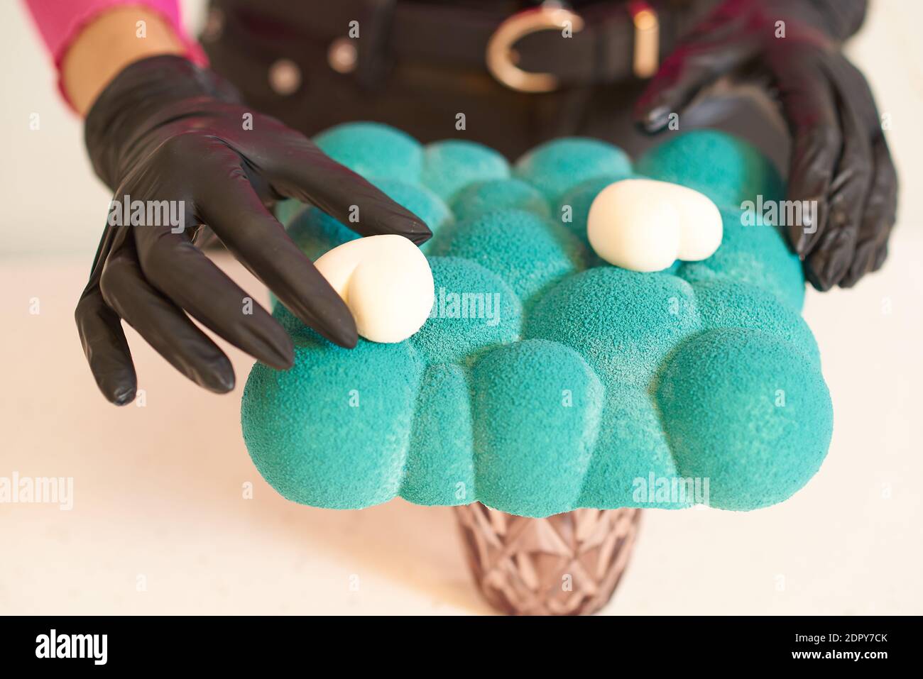 The girl decorates the cake. Close hands. Details Stock Photo - Alamy