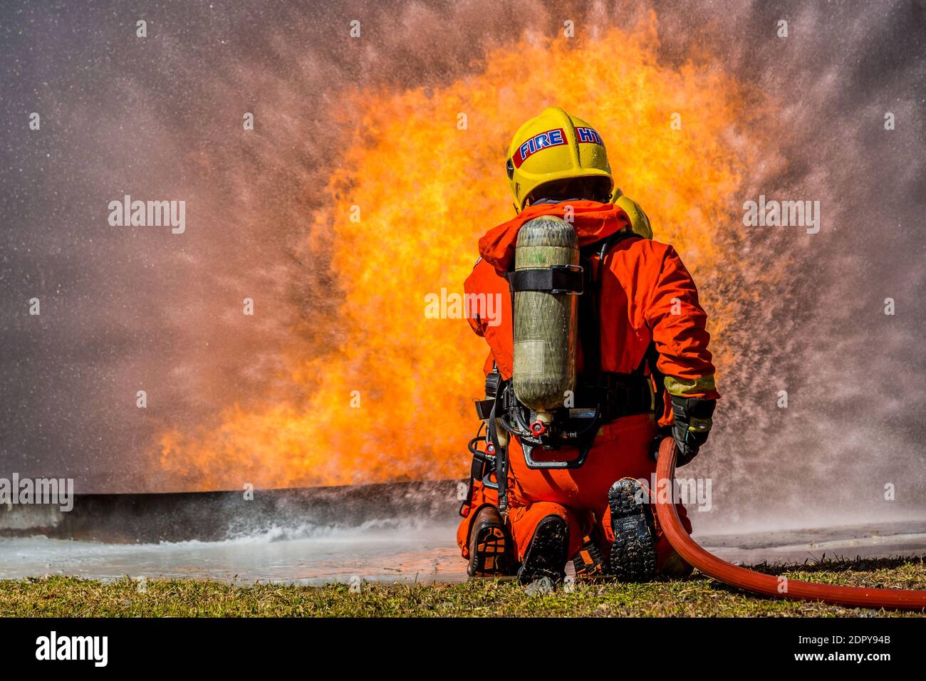 Firemen Using Hose High Resolution Stock Photography and Images - Alamy