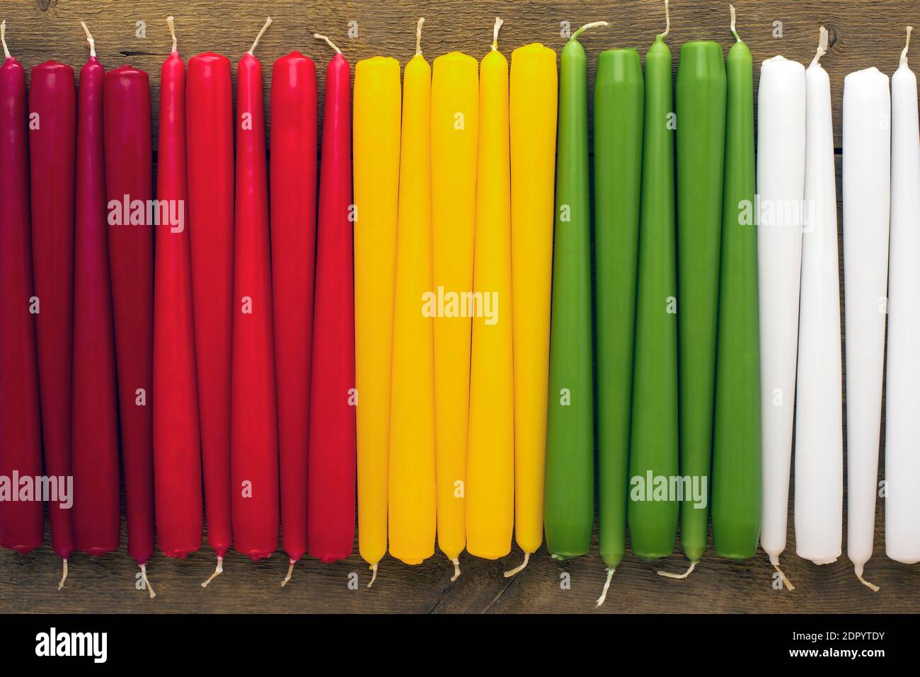 Different colored stick candles next to each other Stock Photo - Alamy