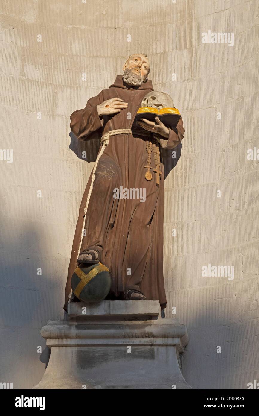 Monk figure with book and skull at the seminary in Hildesheim, Lower ...