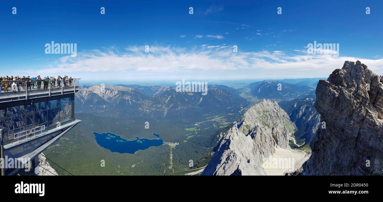 Viewing platform with tourists on the Zugspitze with view of the Eibsee ...