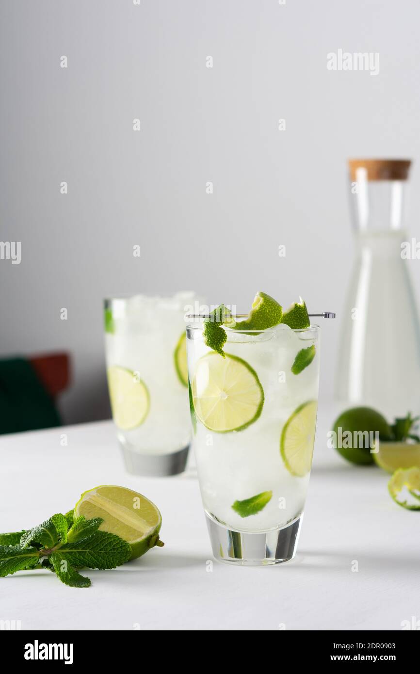 Refreshing cold drinks with lime and mint, glasses with lemonade and ...