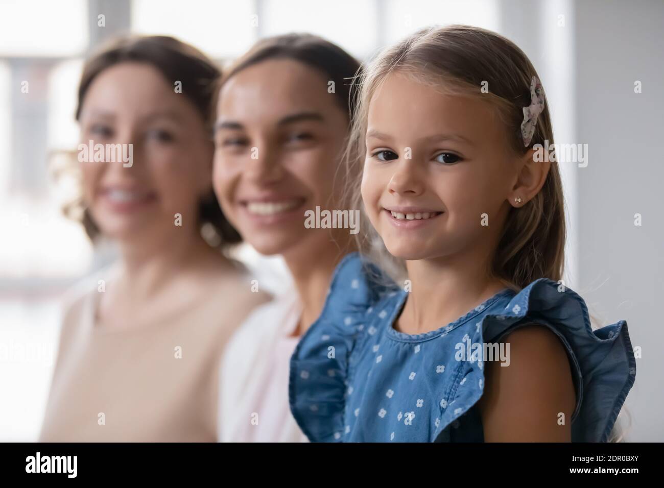 Head shot portrait happy three generations of women, aging process ...