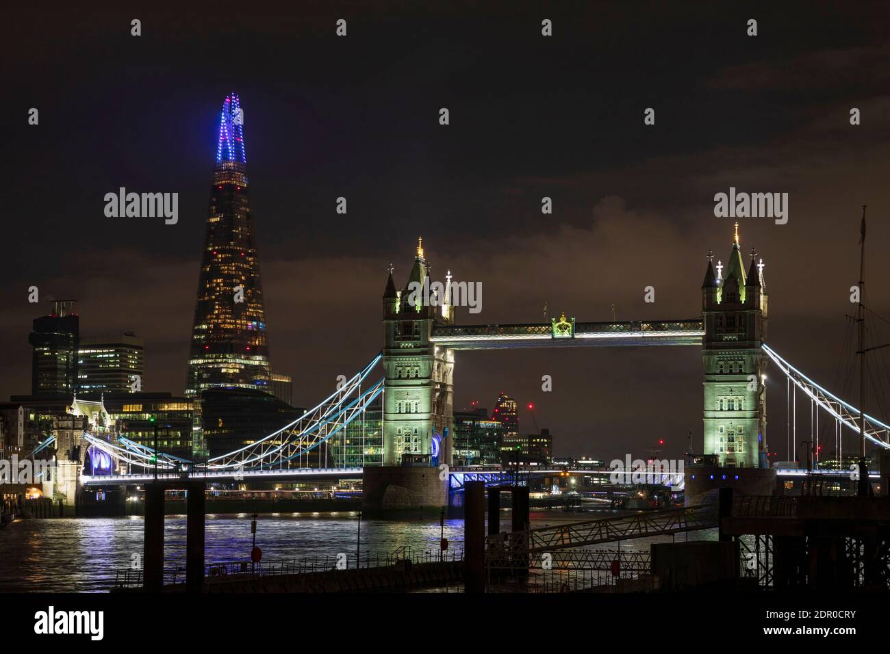 The Shard with special spire lights illuminating the London skyline and ...