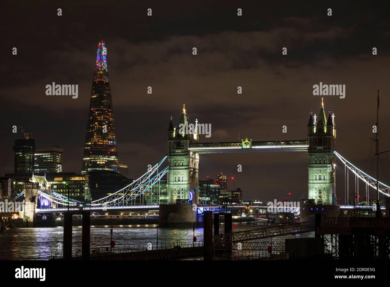 The Shard with special spire lights illuminating the London skyline and ...