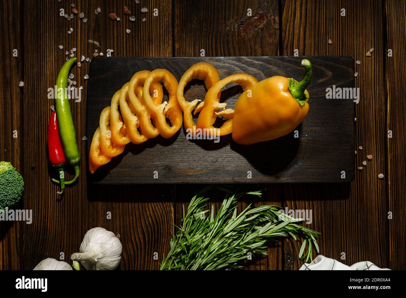 Fresh cutted pepper on board, top view Stock Photo - Alamy