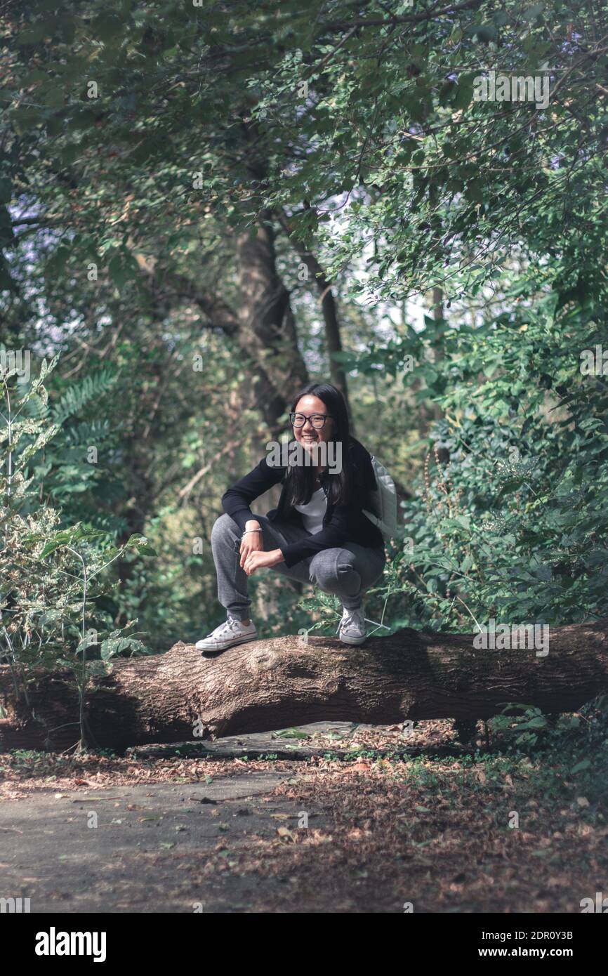 Asian teenager crouching hi-res stock photography and images - Alamy