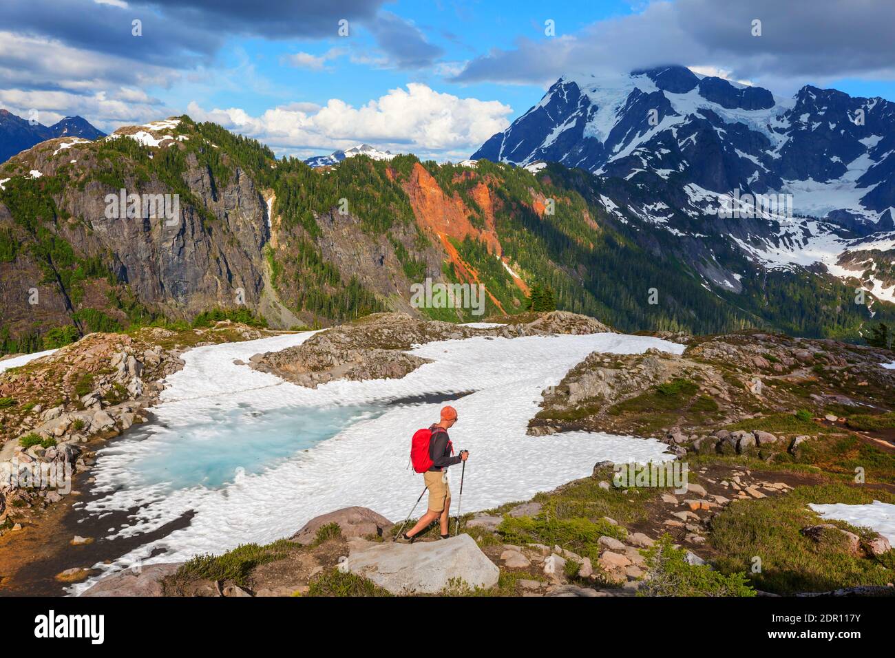 Backpacker in the summer mountains Stock Photo - Alamy