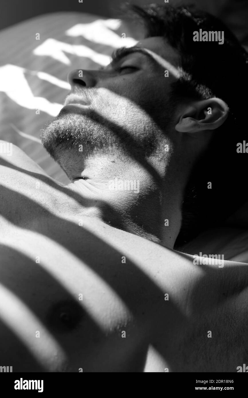 Man looking down shadow face close up Black and White Stock Photos ...