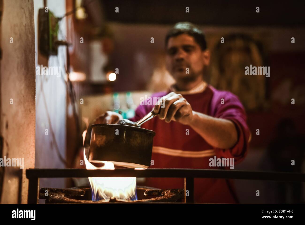 Man making indian tea in hi-res stock photography and images - Alamy