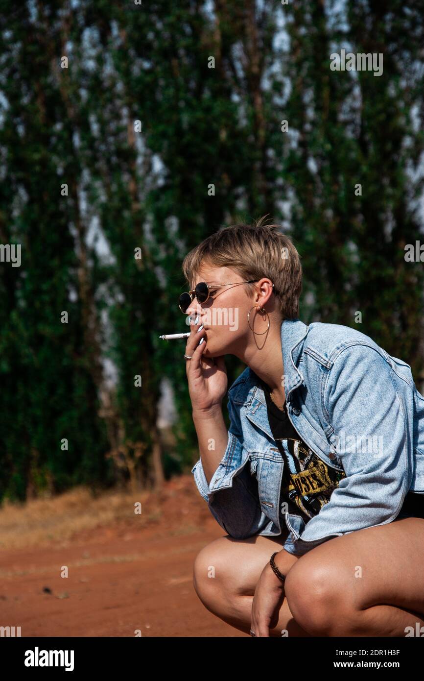 Woman smoking in tree hi-res stock photography and images - Alamy