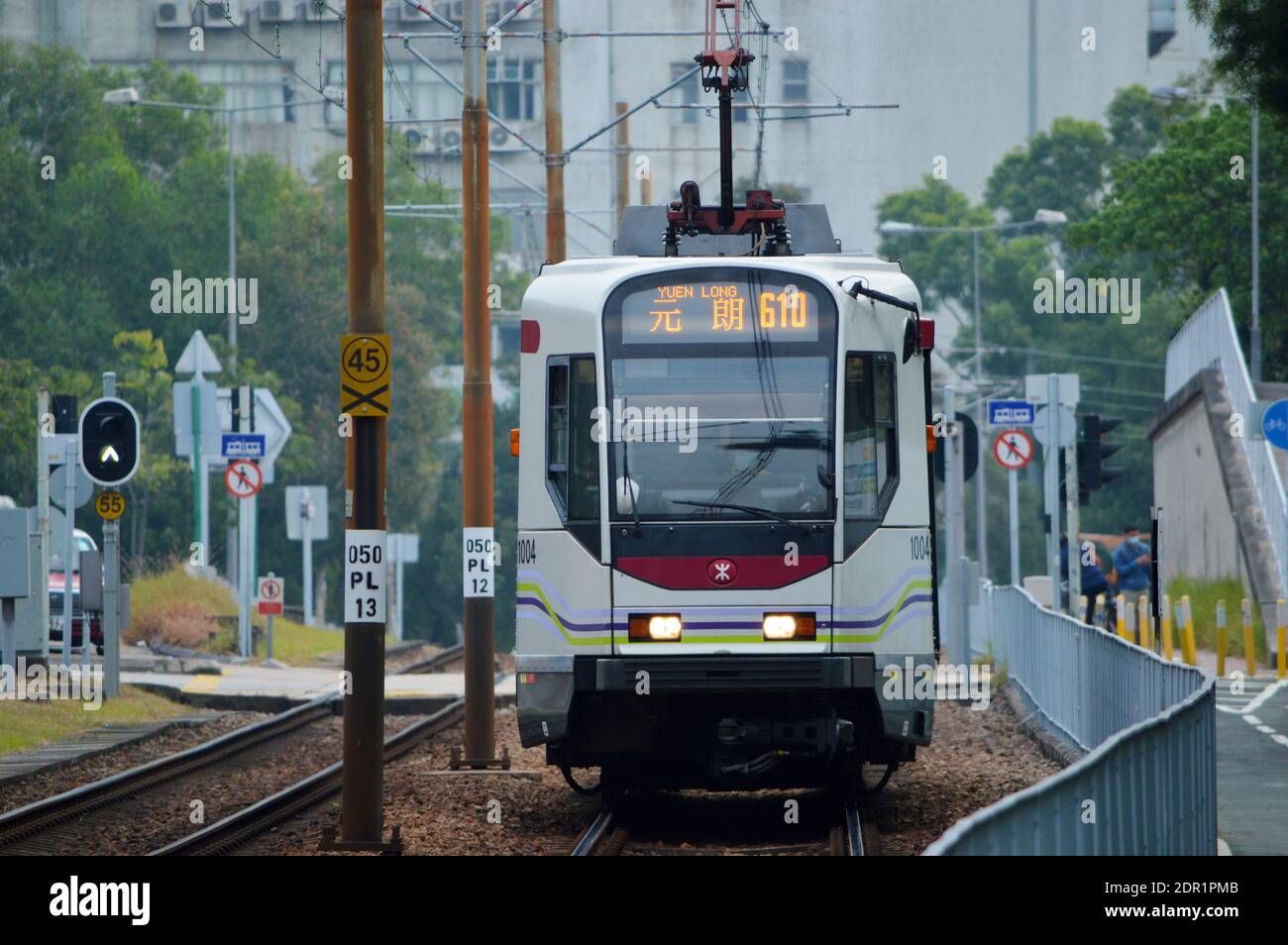 Light rail train approaching Tsing Wun Stop, Tuen Mun, Hong Kong Stock ...