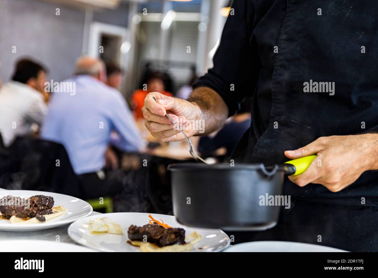 Group Of People Preparing Food In Restaurant Stock Photo - Alamy