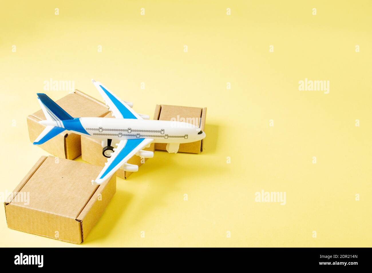 Airplane and stack of cardboard boxes. concept of air cargo and parcels ...