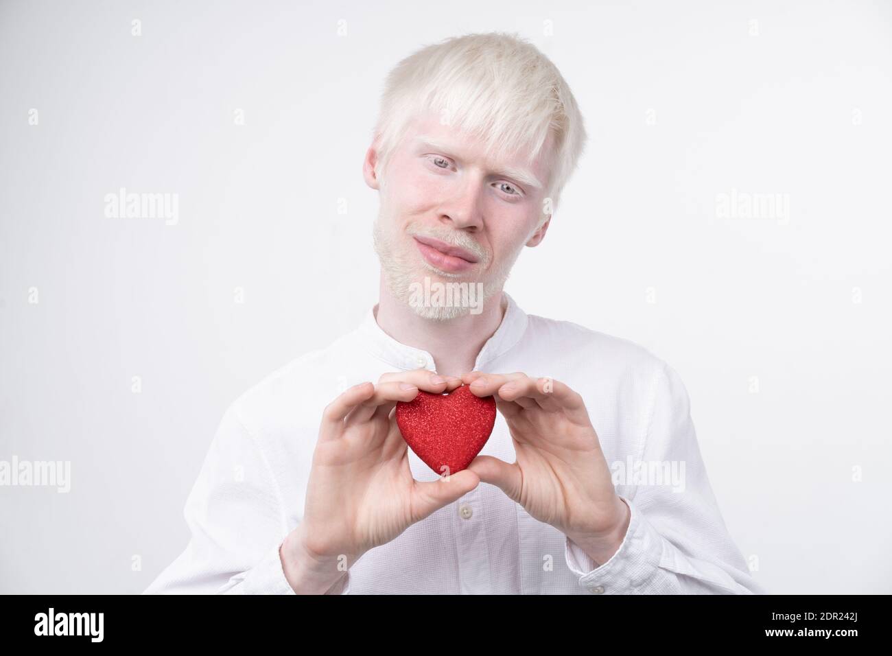 albinism albino man in studio dressed t-shirt isolated on a white ...