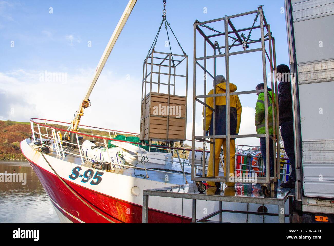 Fishermen unloading fishing trawler catch, Union Hall, West Cork ...