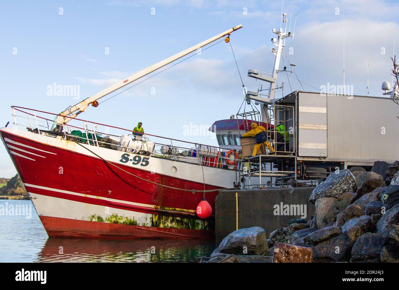 Fishermen unloading fishing trawler catch, Union Hall, West Cork ...