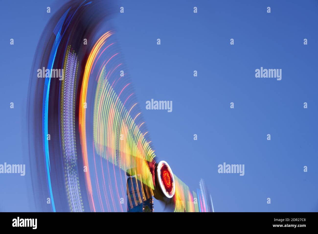 Amusement park blurred effect. Abstract illuminated background Spinning ...