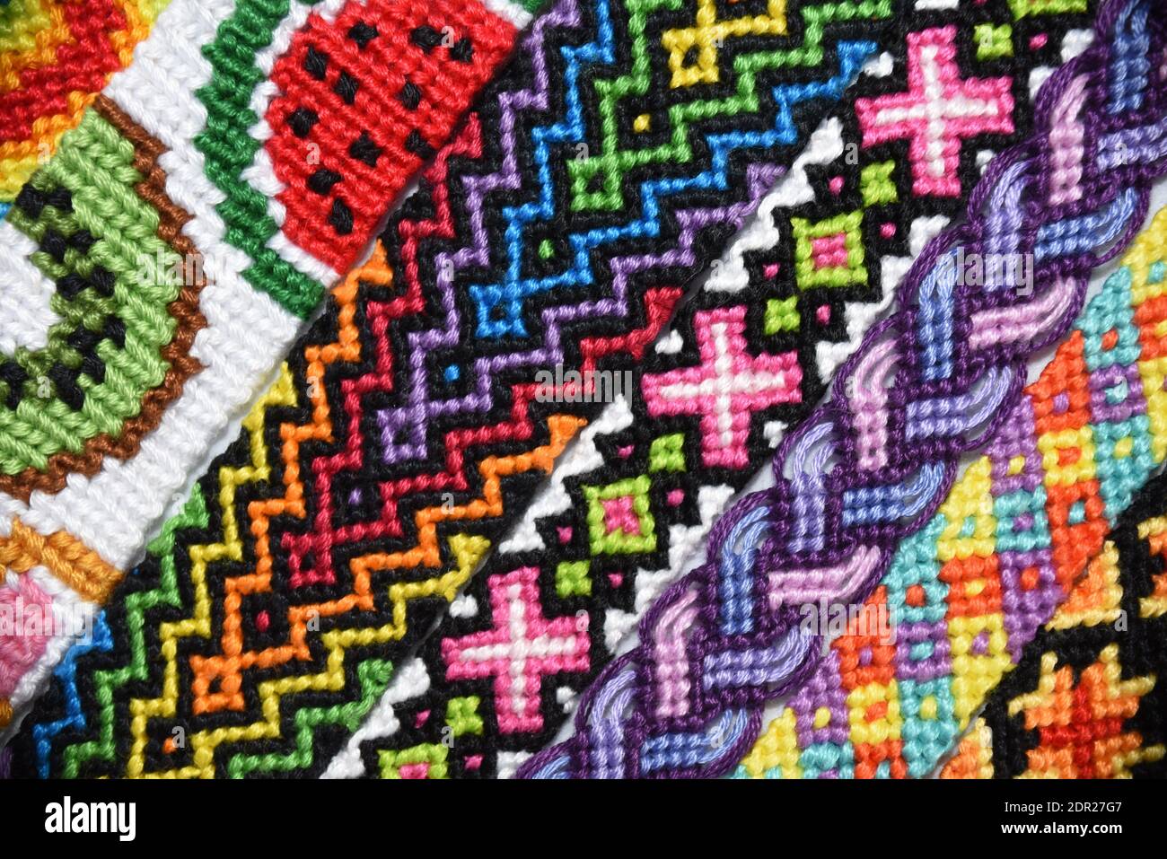 Knots of woven DIY friendship bracelets with alpha and normal patterns ...