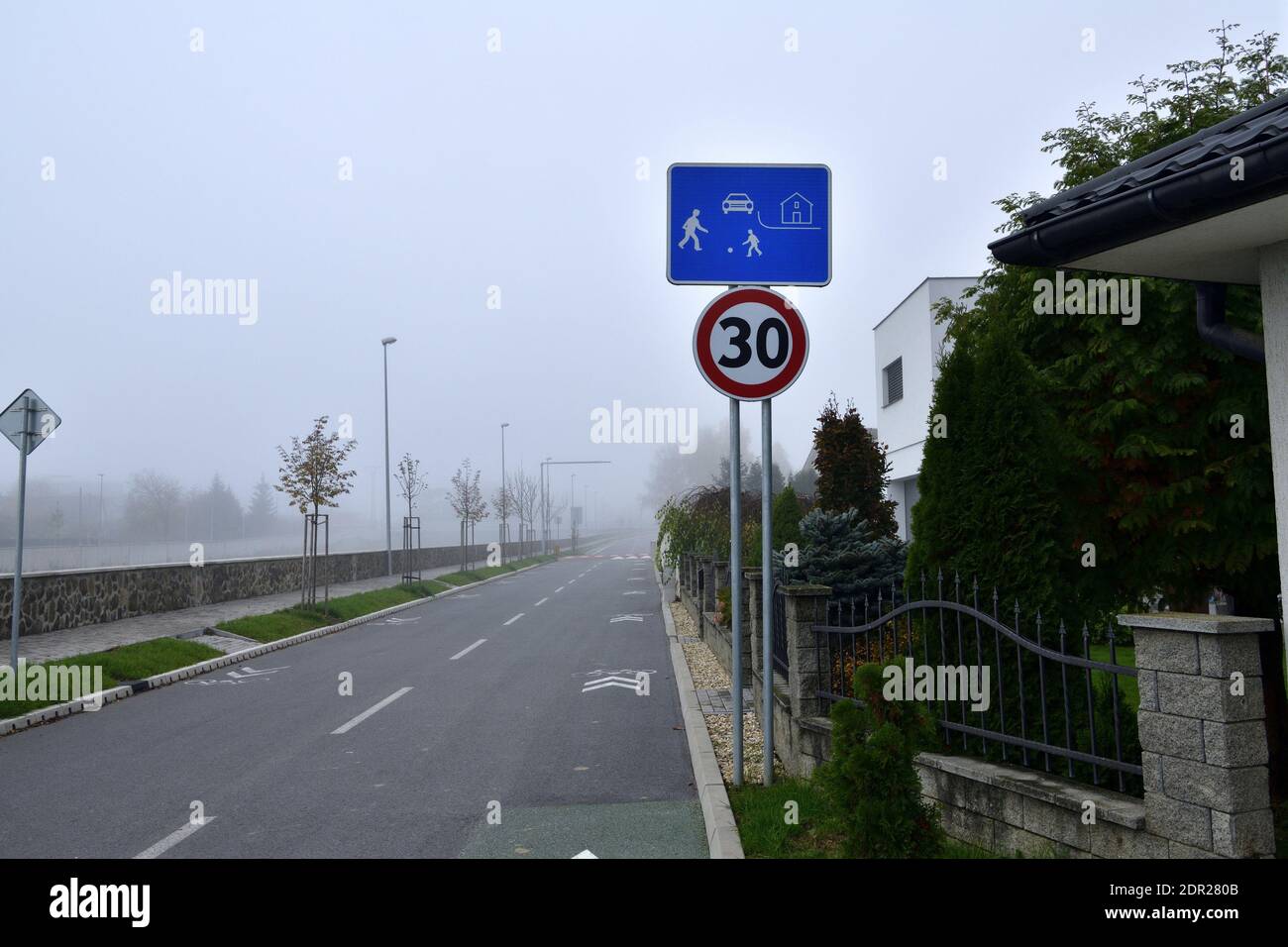 Traffic sign pedestrian zone with limited speed near residential houses ...