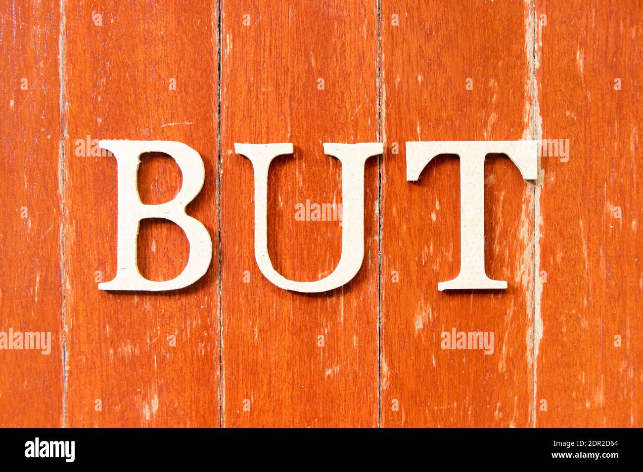Alphabet letter in word but on old red color wood plate background ...