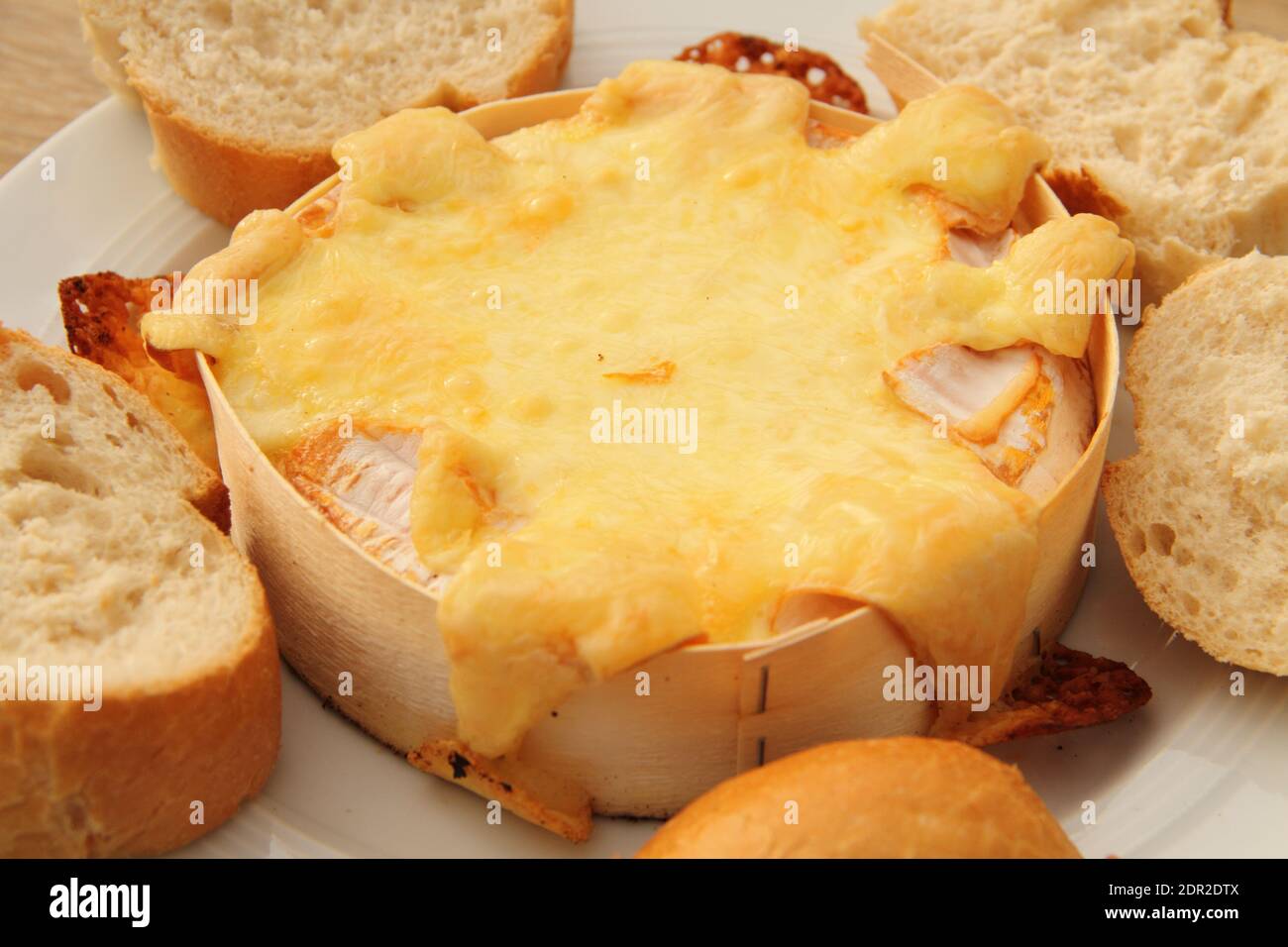 an oven-baked camembert with bread rolls Stock Photo - Alamy