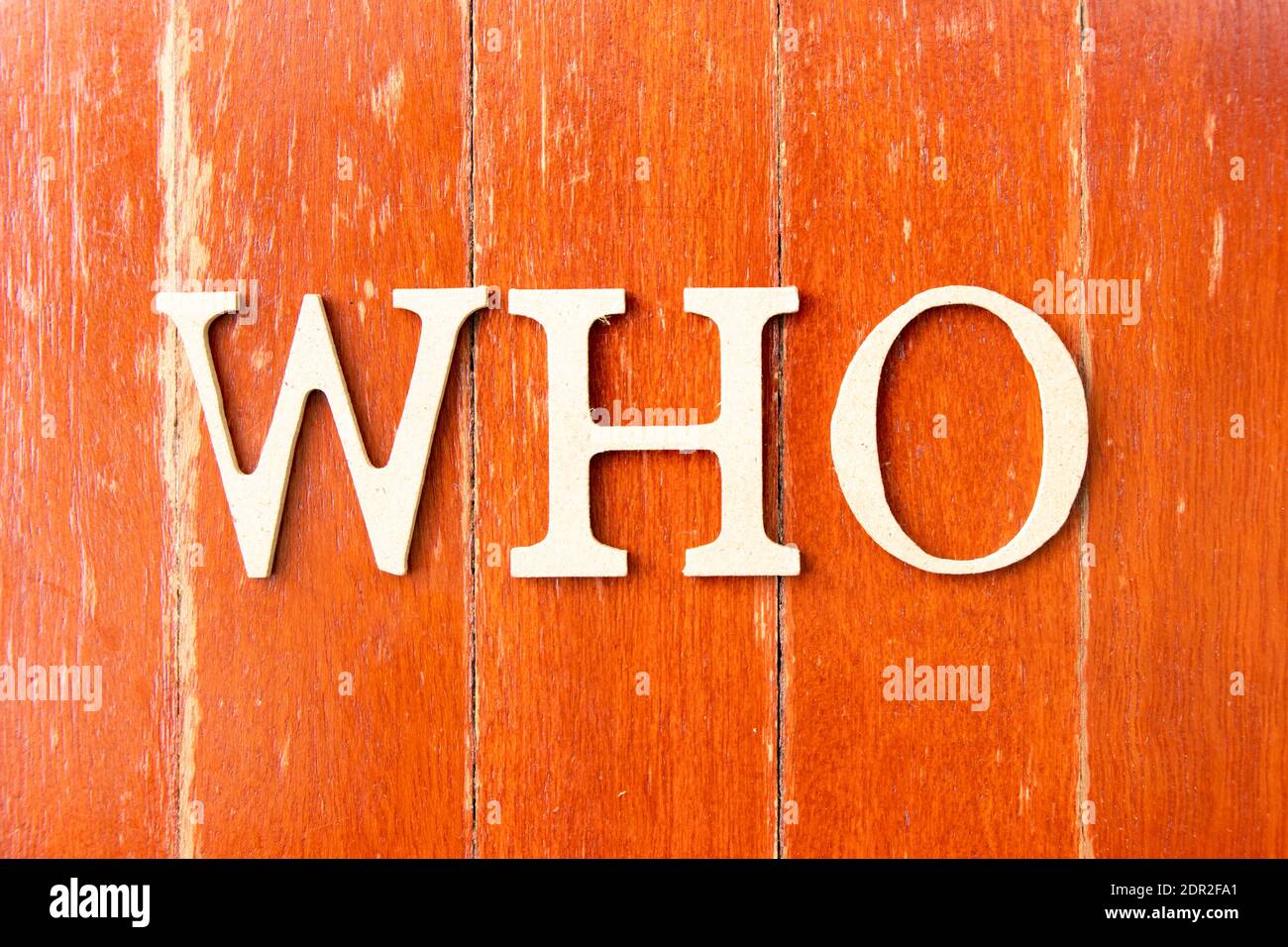 Alphabet letter in word who on old red color wood plate background ...