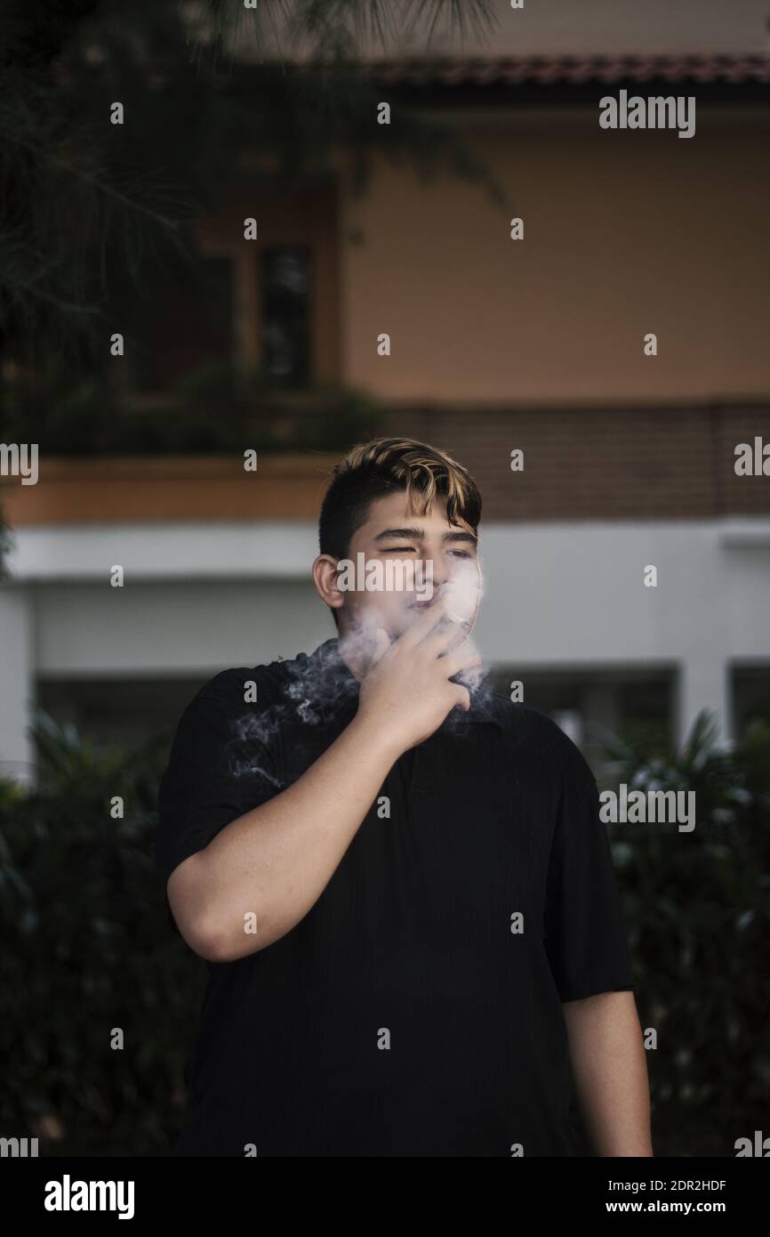 Overweight smoking hi-res stock photography and images - Alamy