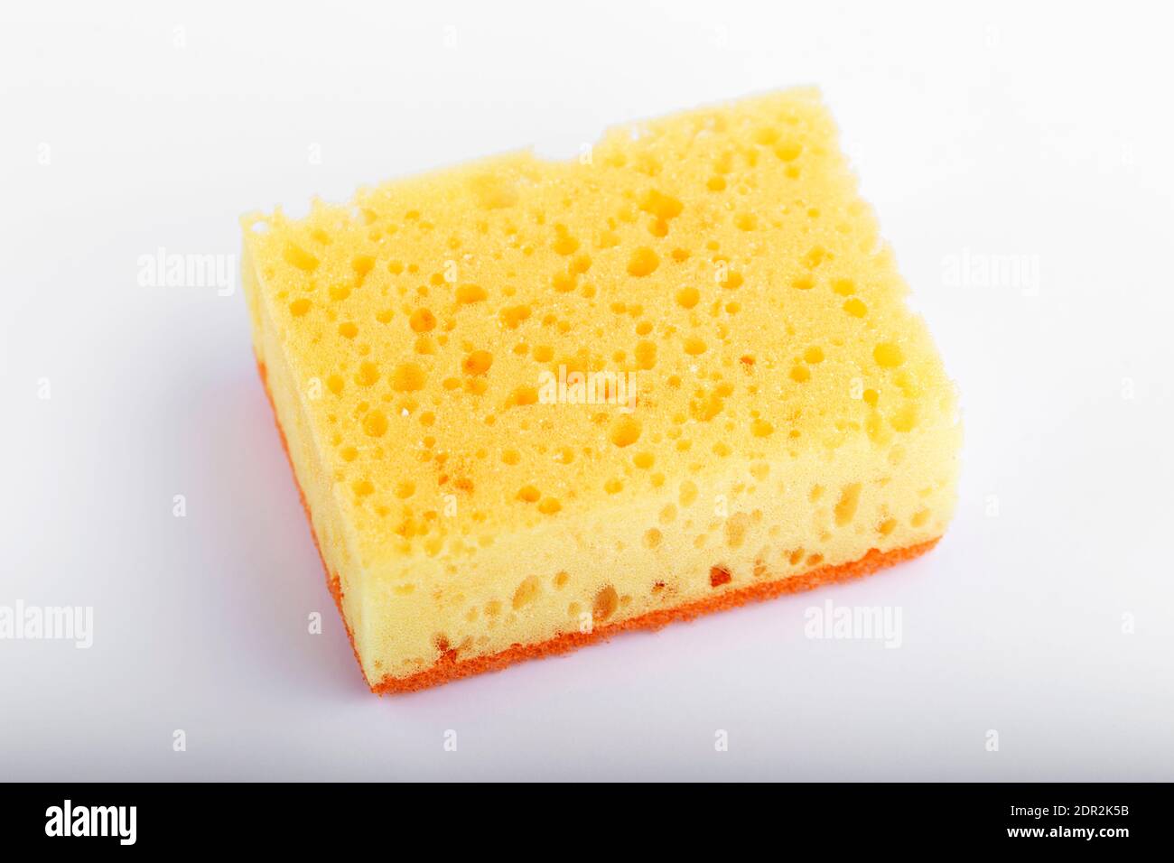 Dishwashing sponge yellow orange isolated white background. File ...