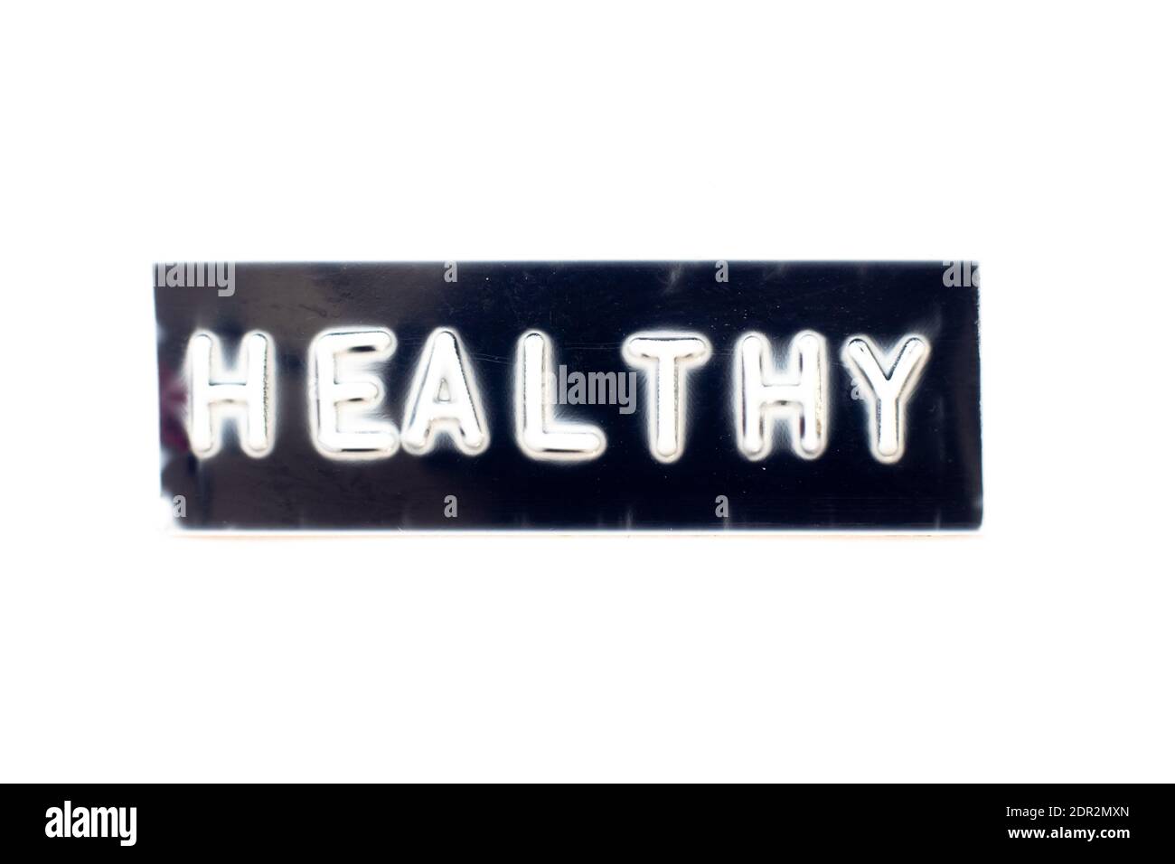 Embossed letter in word healthy on black banner with white background ...