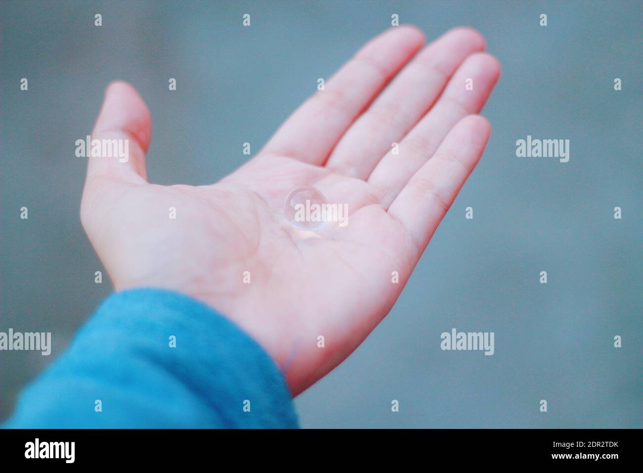 Holding marbles hi-res stock photography and images - Alamy