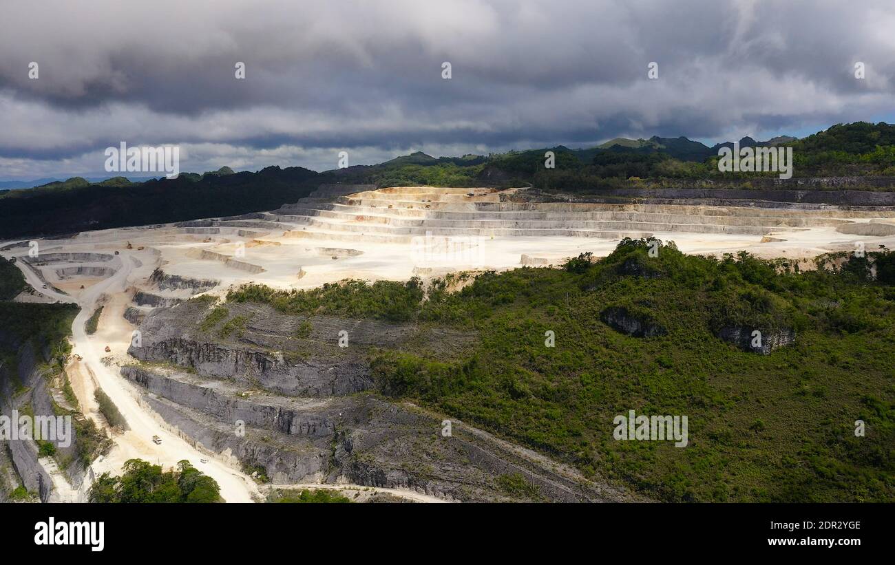 A multi-level limestone quarry in the mountainous part of Bohol Island ...
